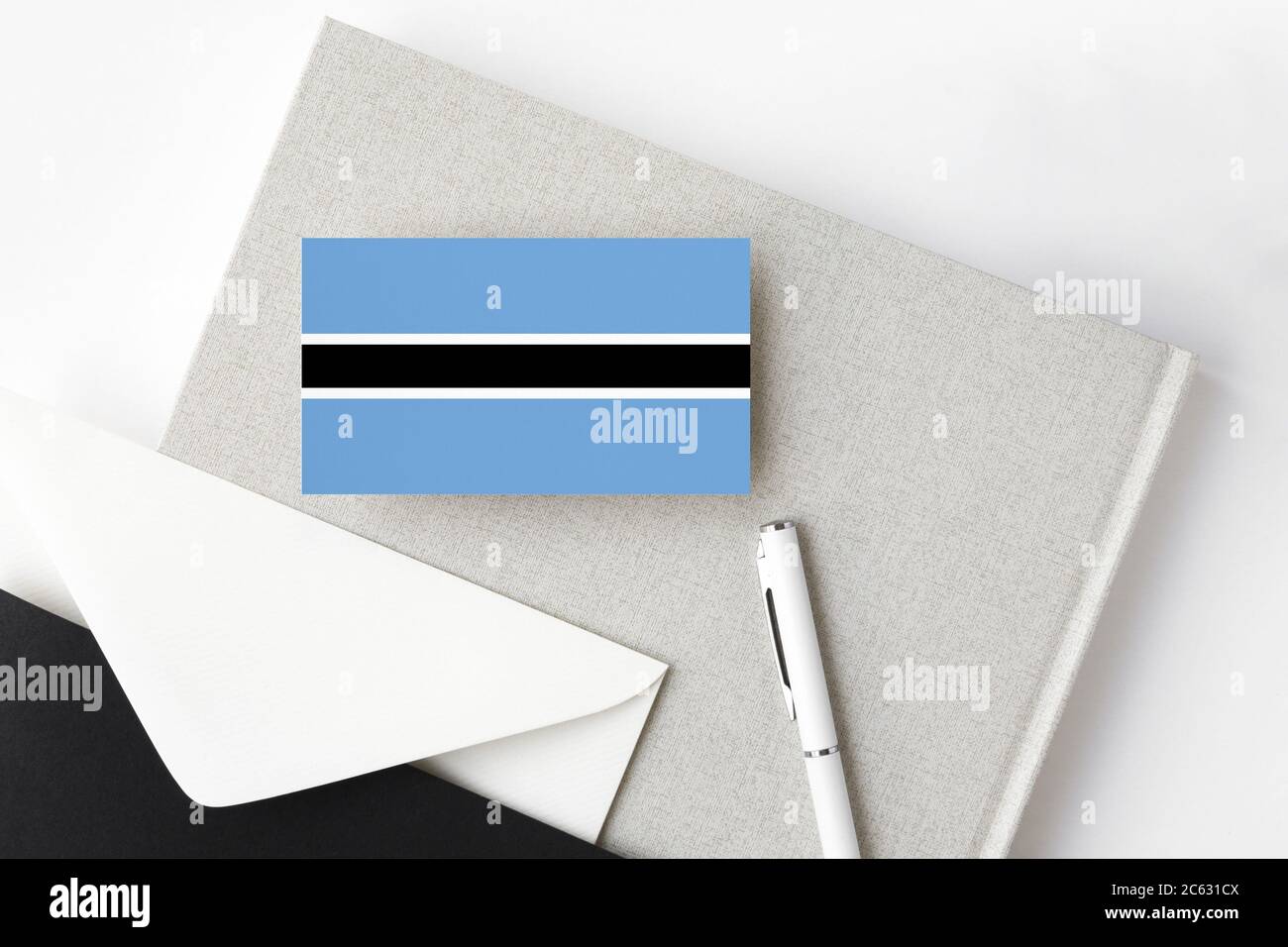 Botswana flag on minimalist letter background. National invitation ...