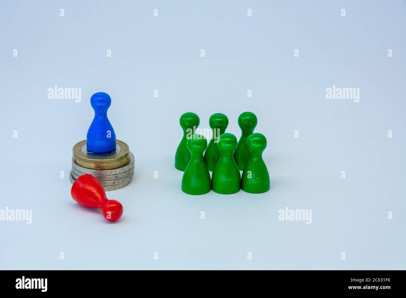 Rich business leader concept with figure on top of coin stack winning ...