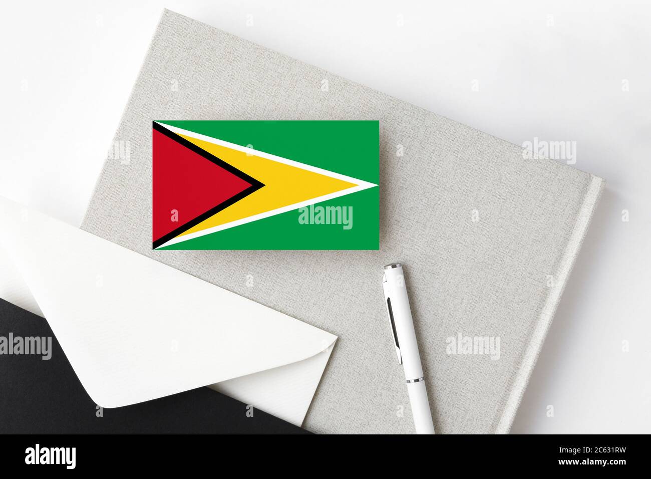 Guyana flag on minimalist letter background. National invitation ...