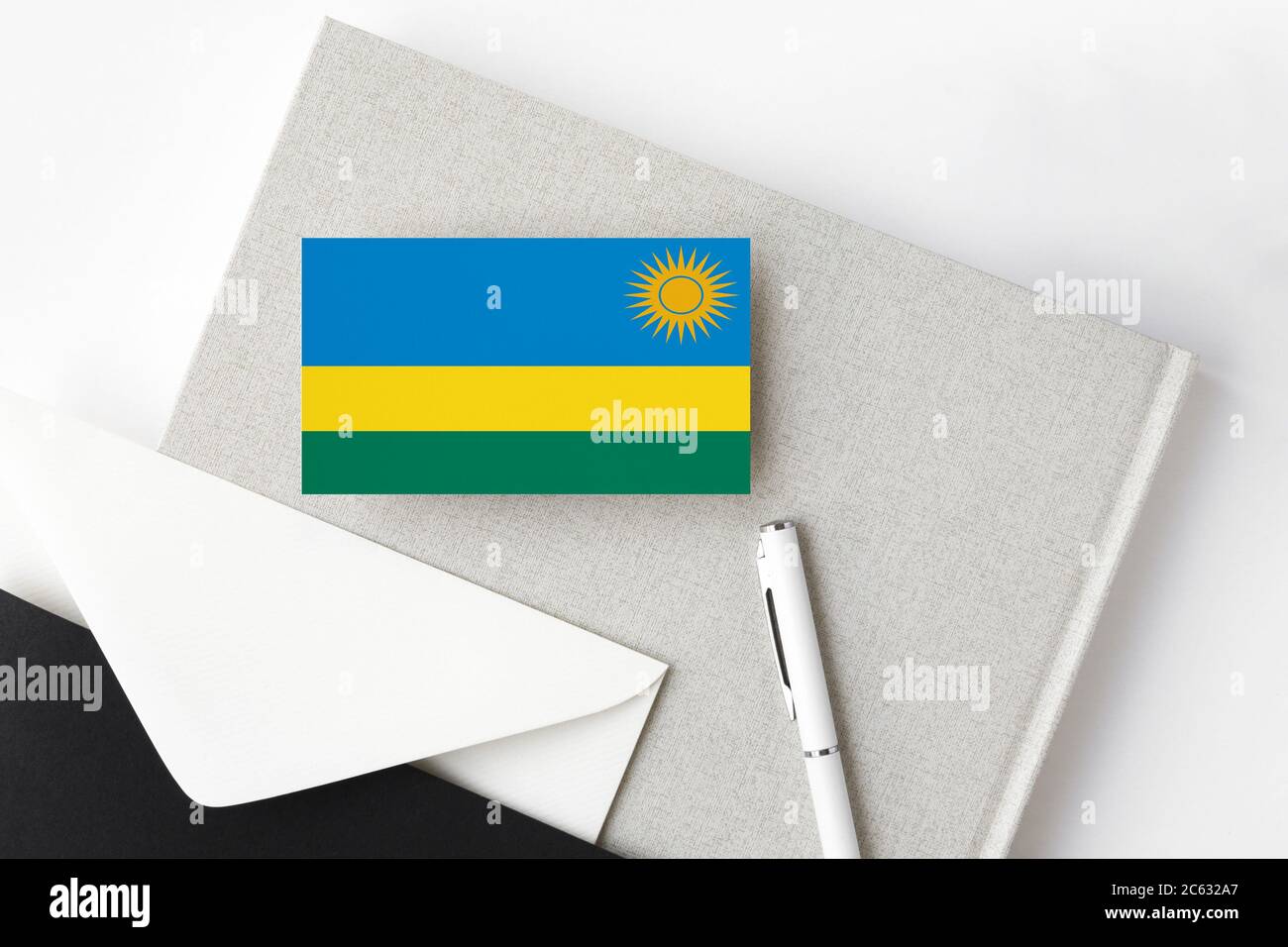 Rwanda flag on minimalist letter background. National invitation ...