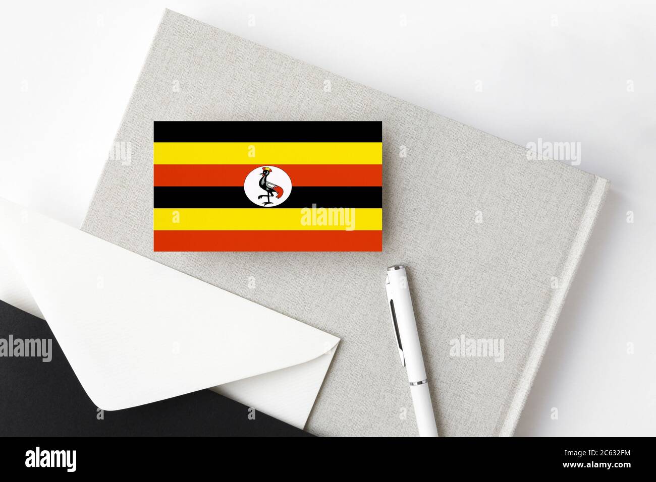 Uganda flag on minimalist letter background. National invitation ...