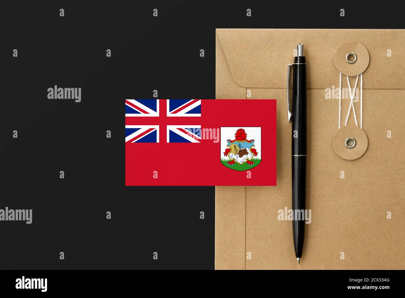 Bermuda flag on craft envelope letter and black pen background ...