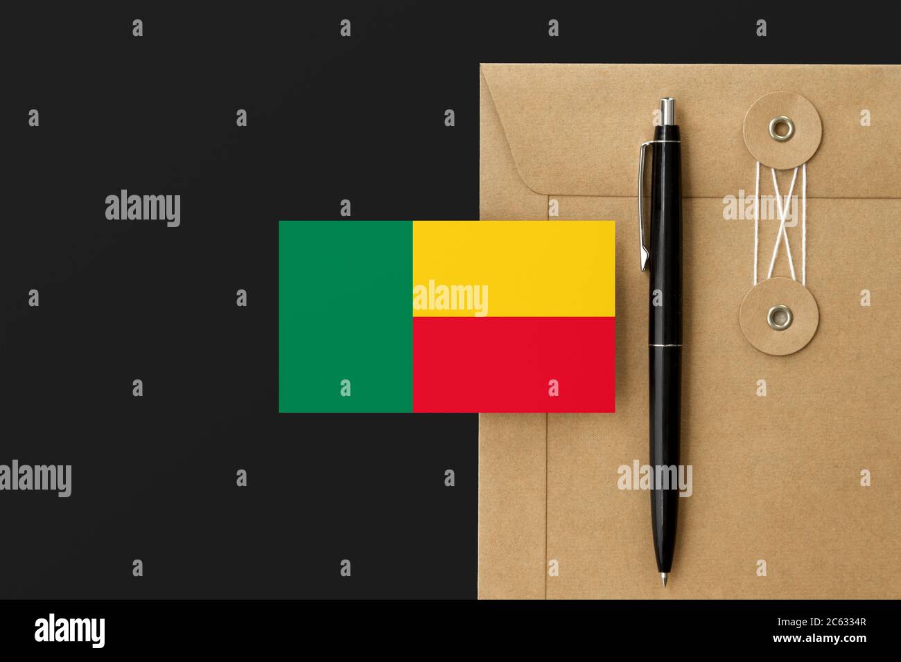 Benin flag on craft envelope letter and black pen background. National ...