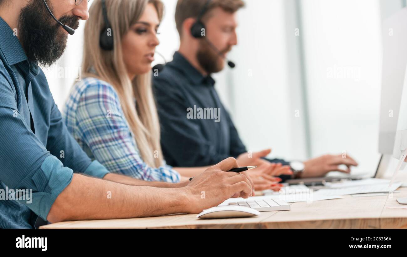 close up. call center operators in the workplace Stock Photo - Alamy