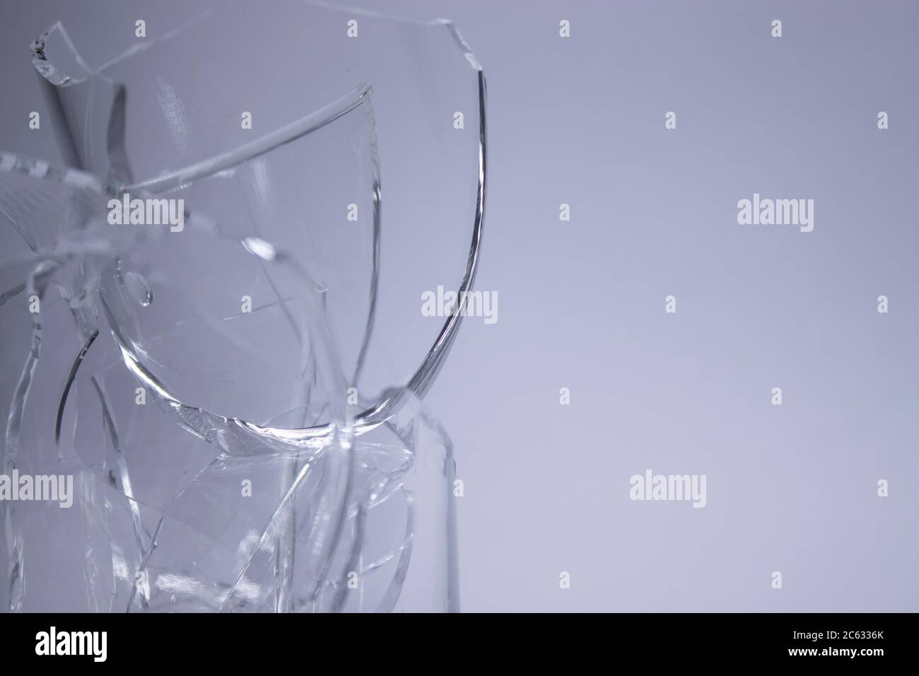 fragments of a broken glass in a broken glass on a white background ...