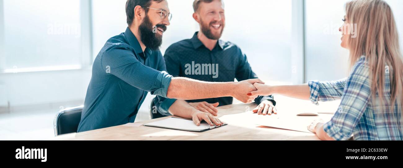 Interviewer handshaking the applicant hi-res stock photography and ...