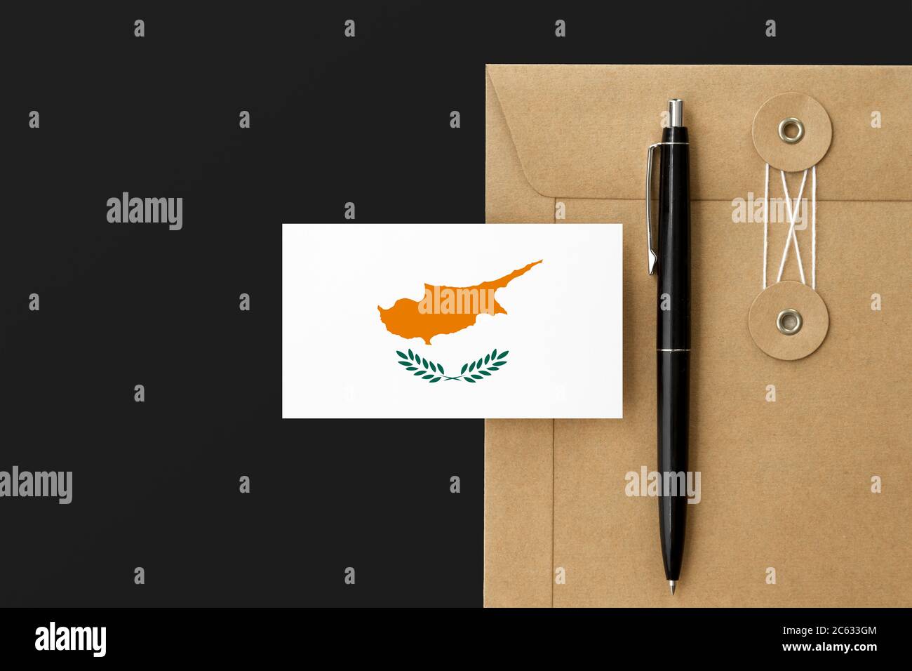 Cyprus flag on craft envelope letter and black pen background. National ...