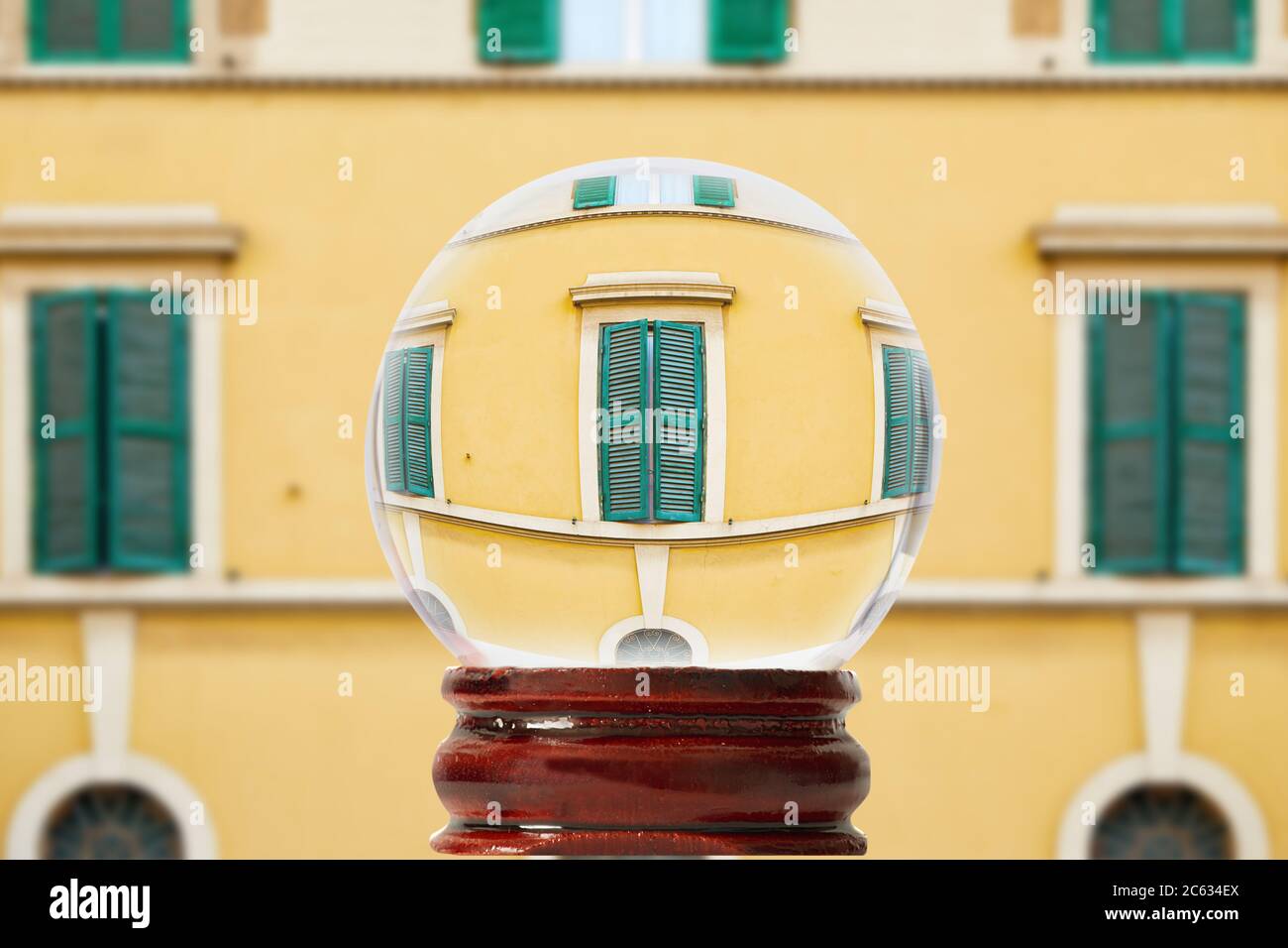 The facade of a building with windows on a street of Rome, Italy ...
