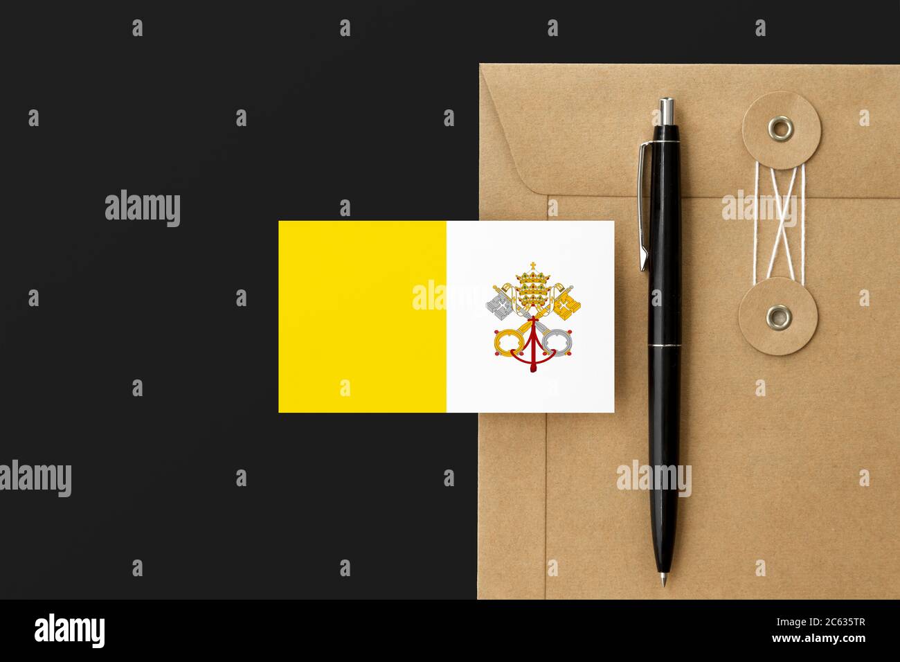 Vatican City flag on craft envelope letter and black pen background ...