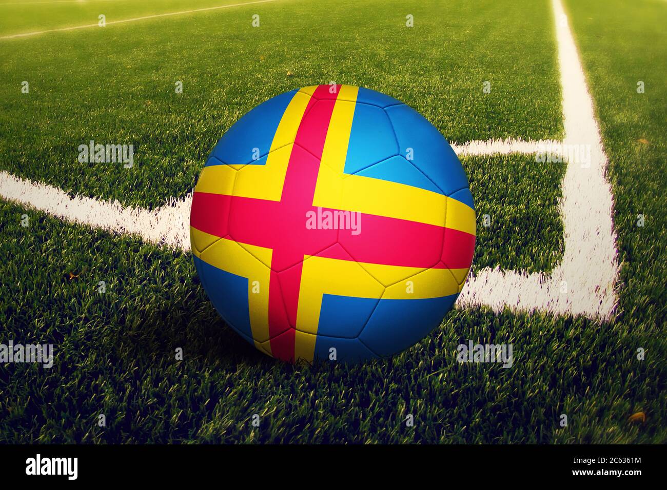 Aland Islands flag on ball at corner kick position, soccer field ...