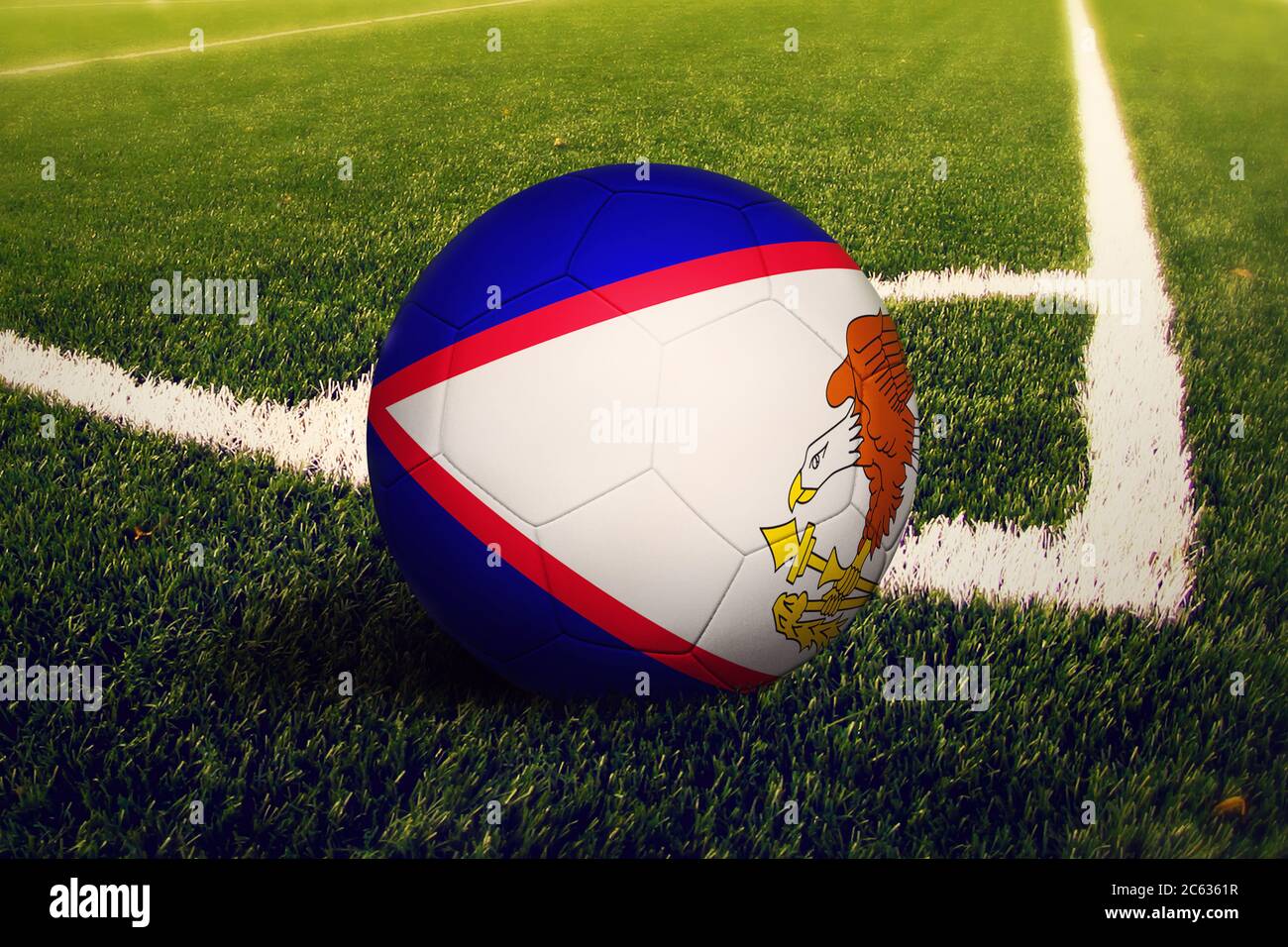 American Samoa flag on ball at corner kick position, soccer field ...