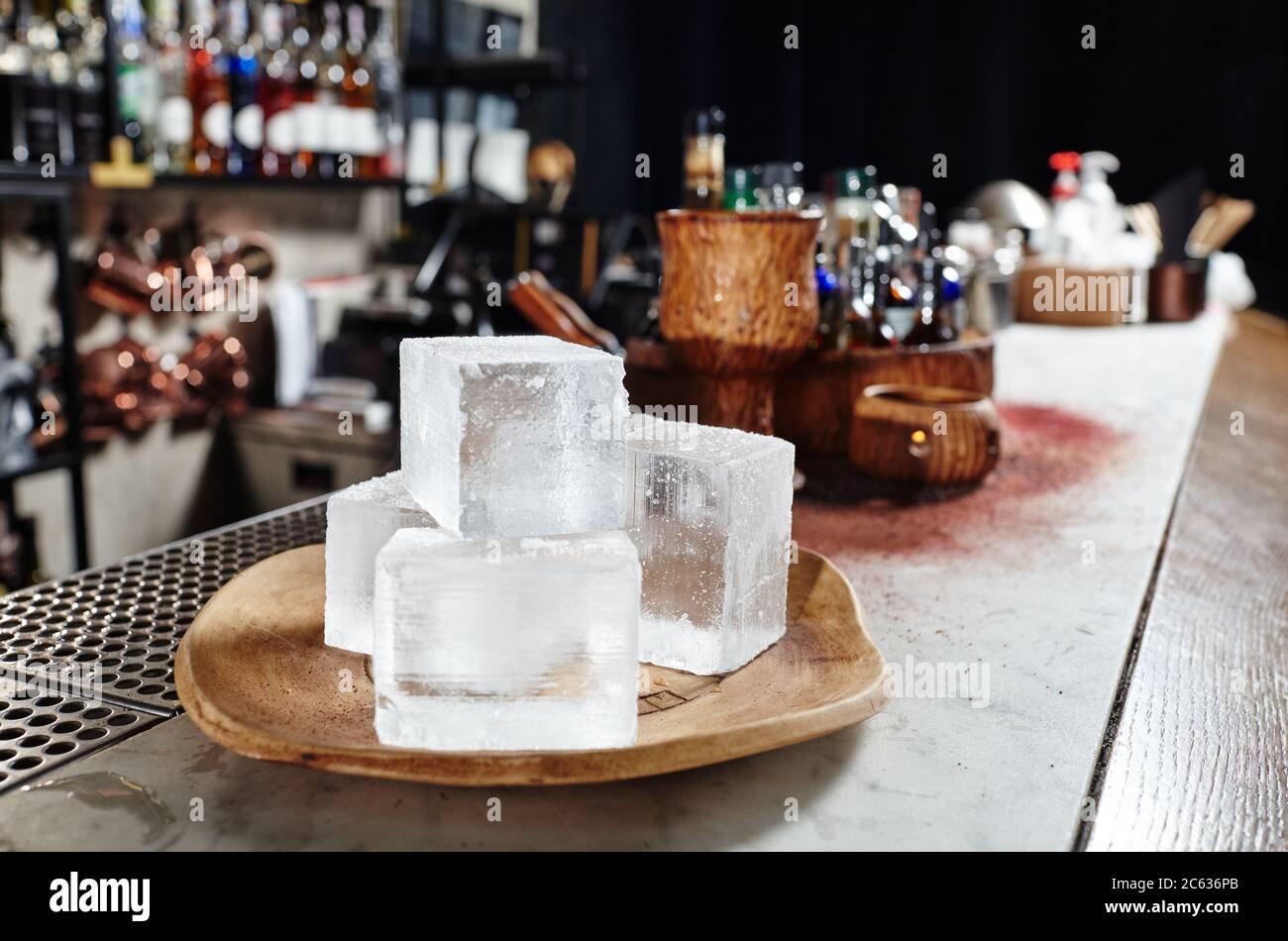 Large pieces of ice on a plate. Ingredient for cooling drinks in bar ...