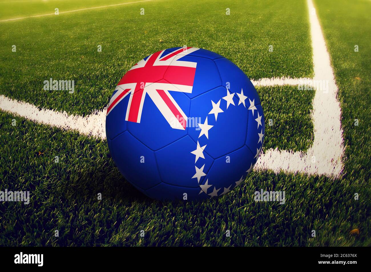 Cook Islands flag on ball at corner kick position, soccer field ...