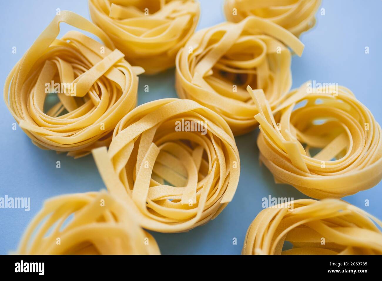 Italian wheat pasta tagliatelle isolated Stock Photo - Alamy
