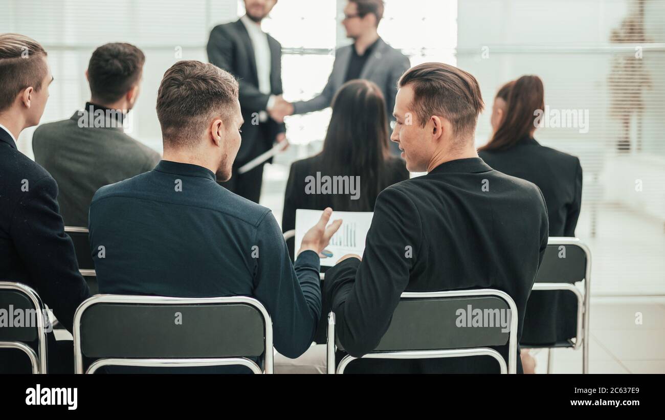 back view. group of employees sitting in a conference room Stock Photo ...