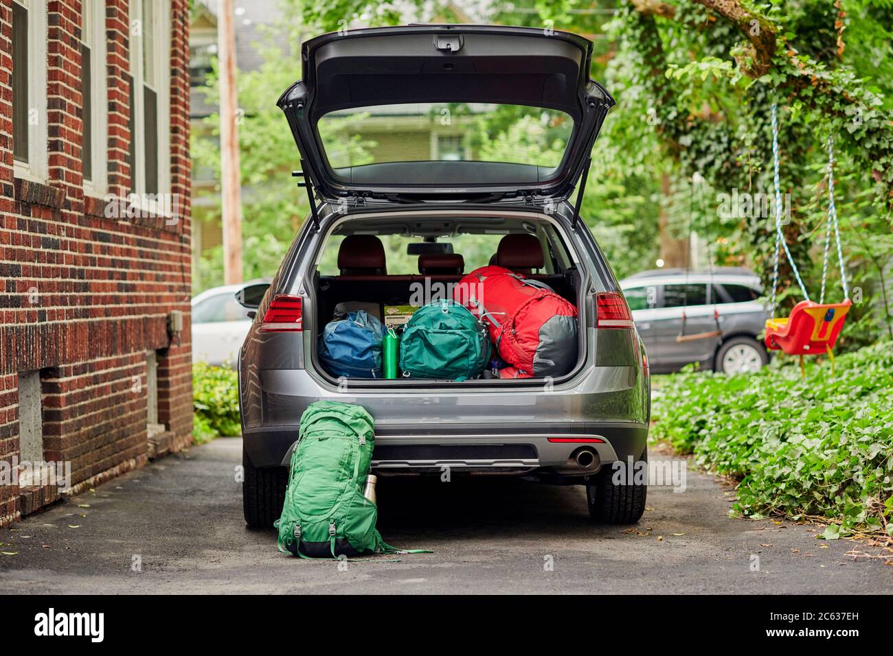 A family car getting packed up for a camping roadtrip in New England ...