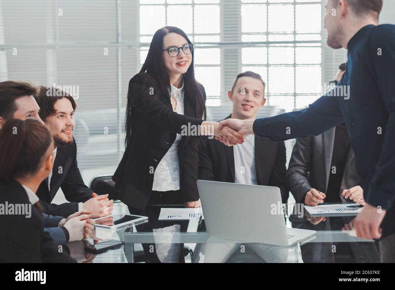 business colleagues greeting each other at an office meeting Stock ...