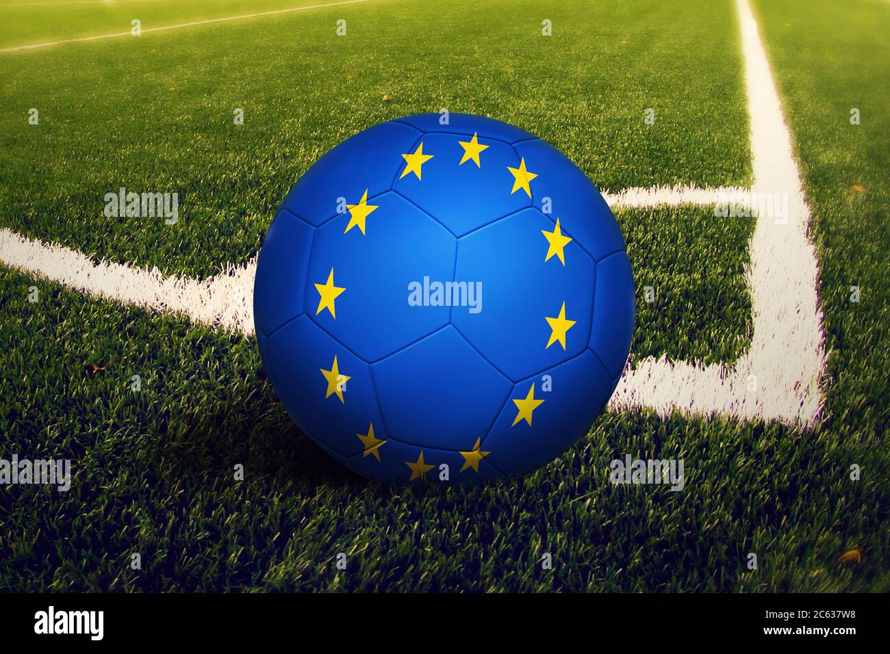 European Union flag on ball at corner kick position, soccer field ...