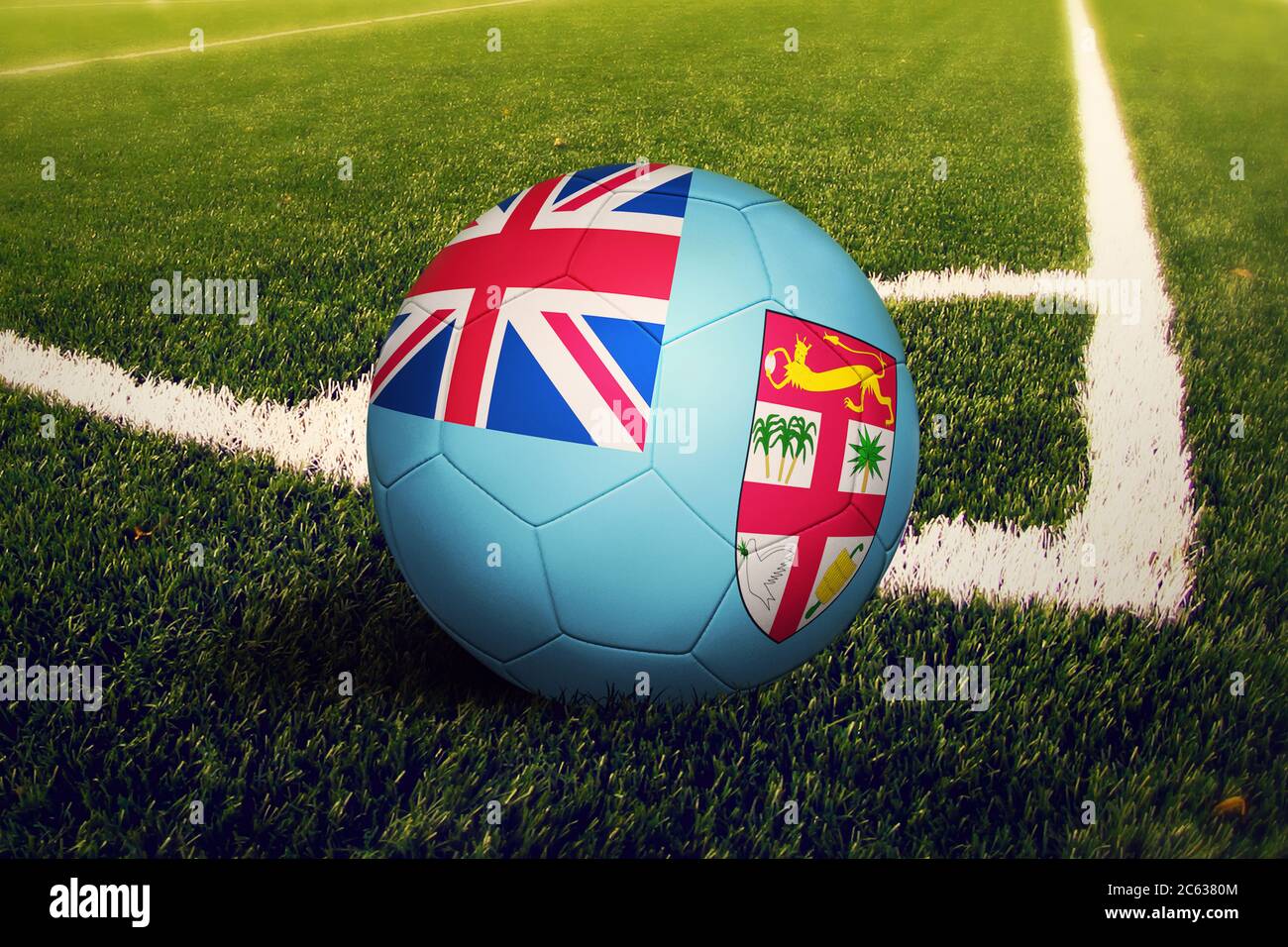 Fiji flag on ball at corner kick position, soccer field background ...