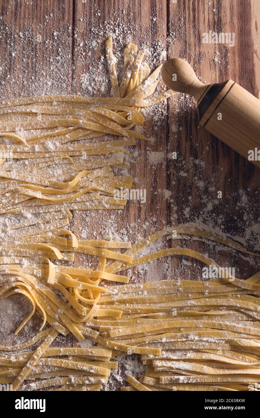 Homemade pasta raw and rolling pin Stock Photo - Alamy
