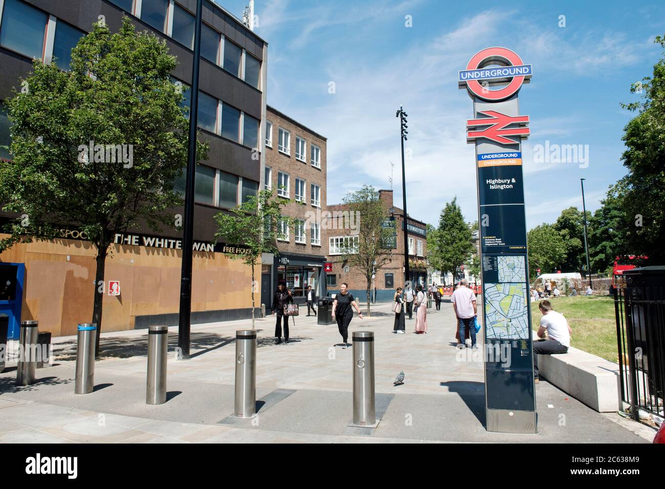 Wide pavement at the newly redesigned Highbury Corner with people with ...