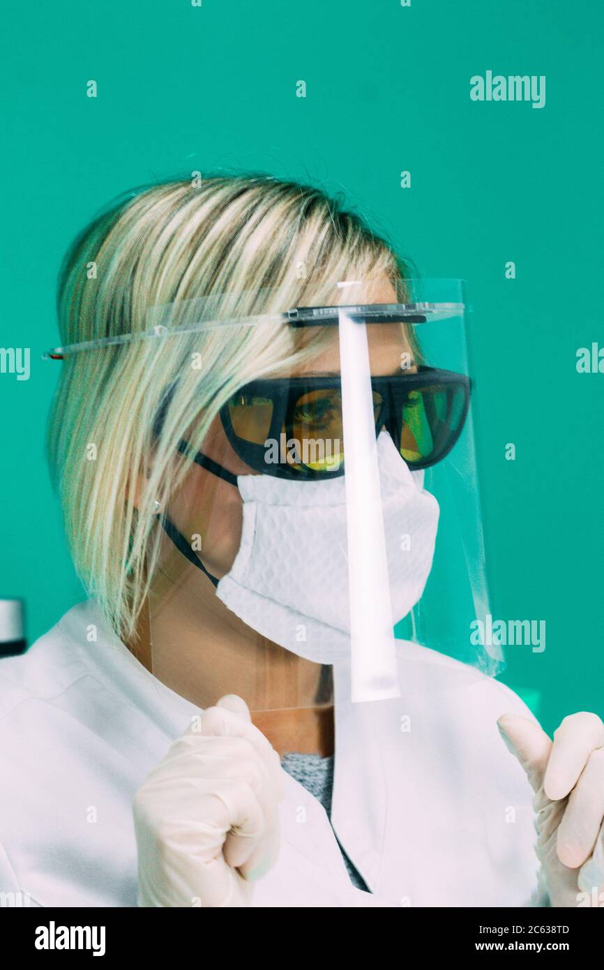 portrait of dosctora woman screen face protection and face mask inside ...