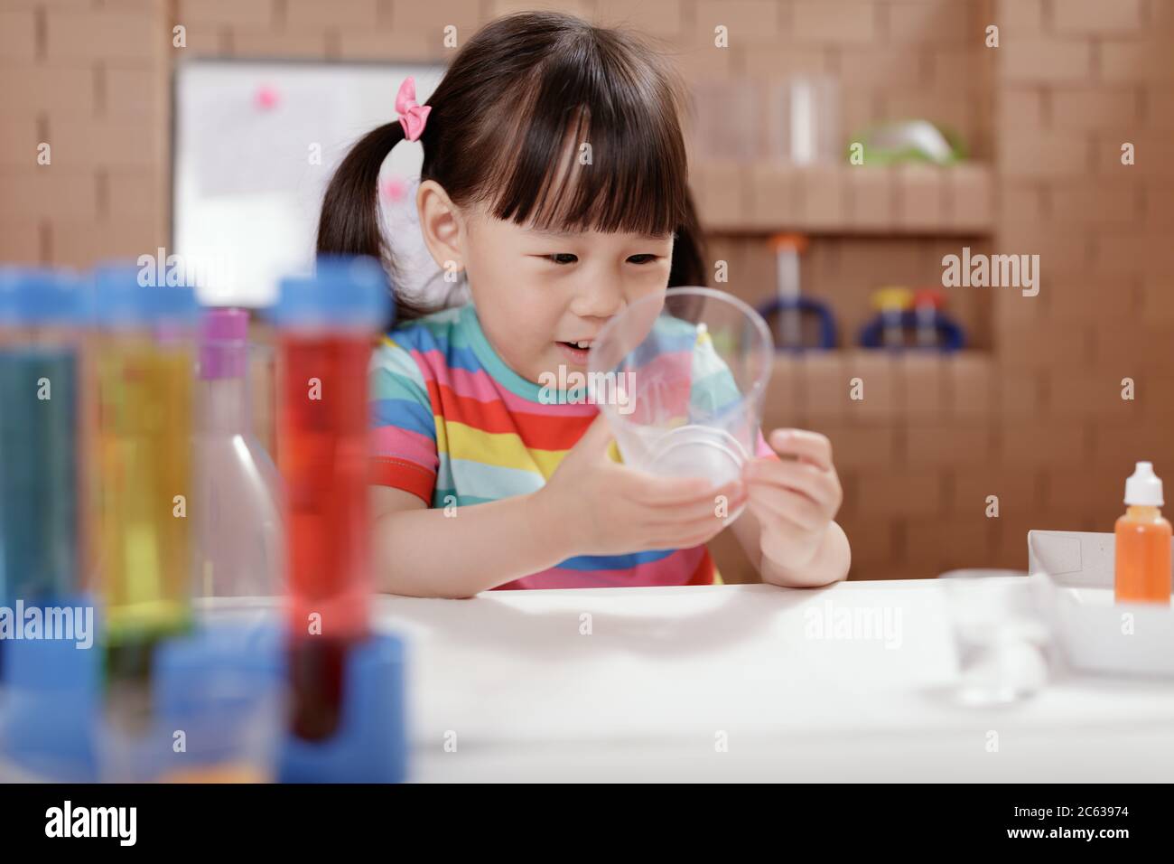 toddler girl play science experiments for homeschooling Stock Photo - Alamy