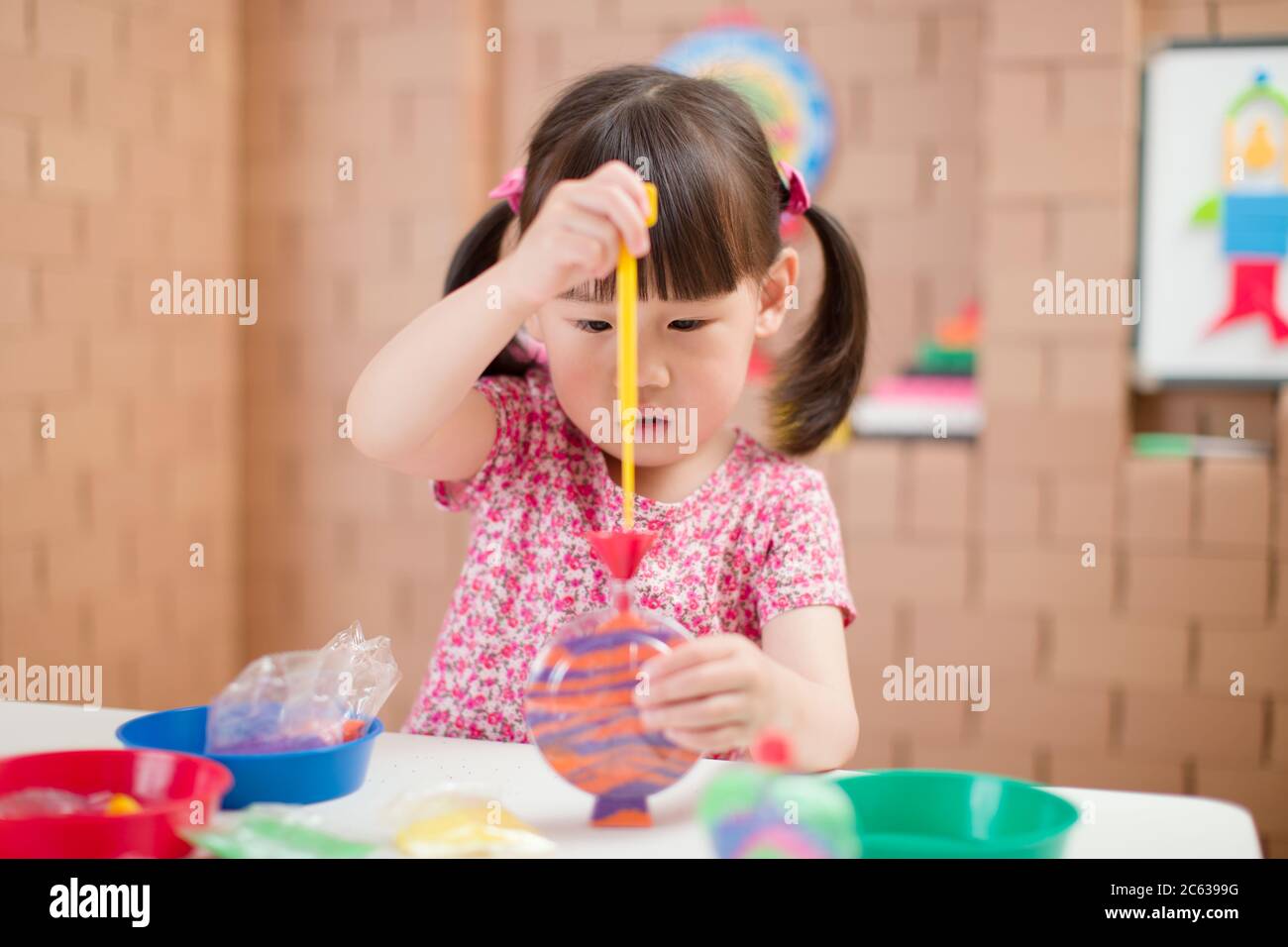 toddler girl making sand animal crafts for homeschooling Stock Photo ...
