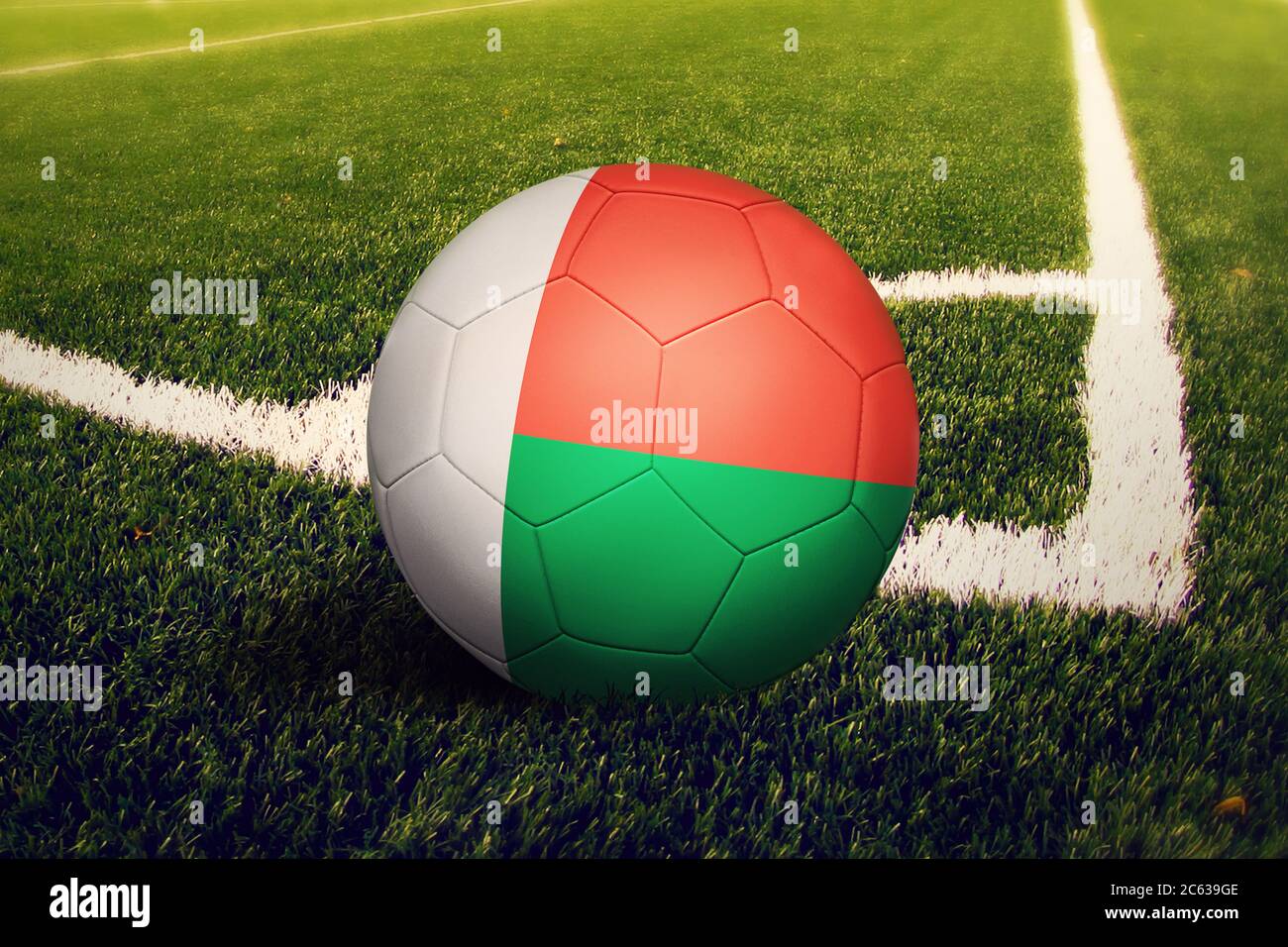 Madagascar flag on ball at corner kick position, soccer field ...