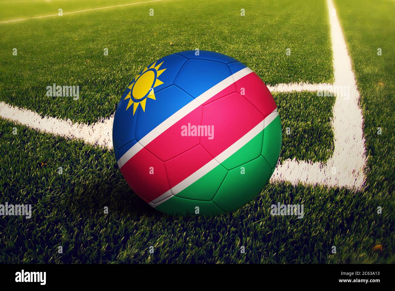 Namibia flag on ball at corner kick position, soccer field background ...
