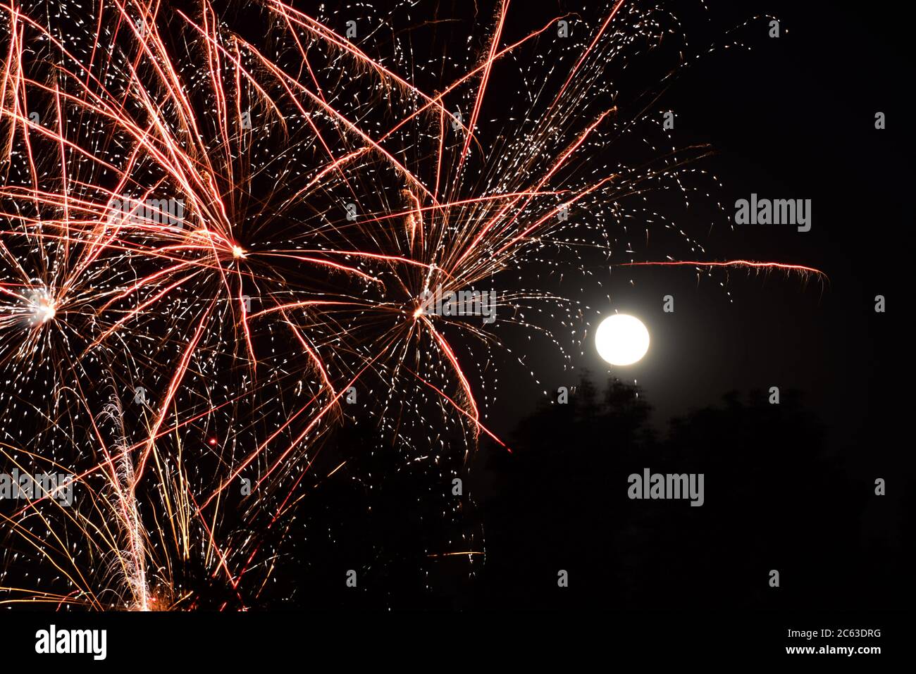 Fireworks and full moon on Independence Day, July 4th Stock Photo - Alamy