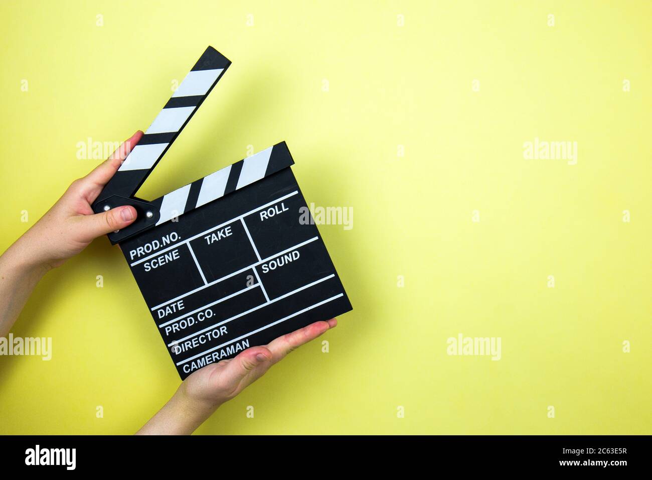 Movie clapper on yellow background, cinema concept Stock Photo - Alamy