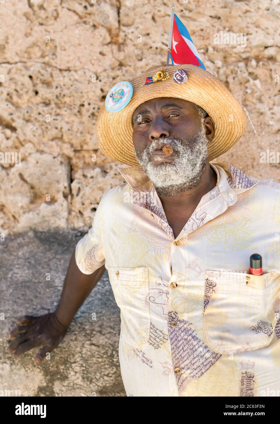 Black man in Havana smoking a cuban cigar Stock Photo - Alamy