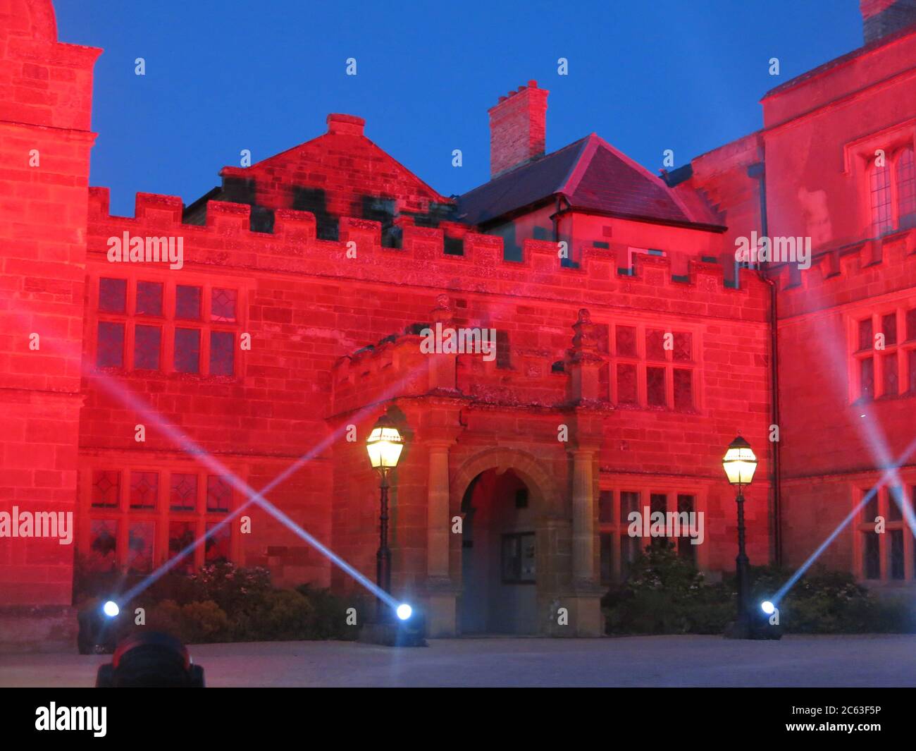 The front entrance and facade of Delapre Abbey illuminated at night in ...