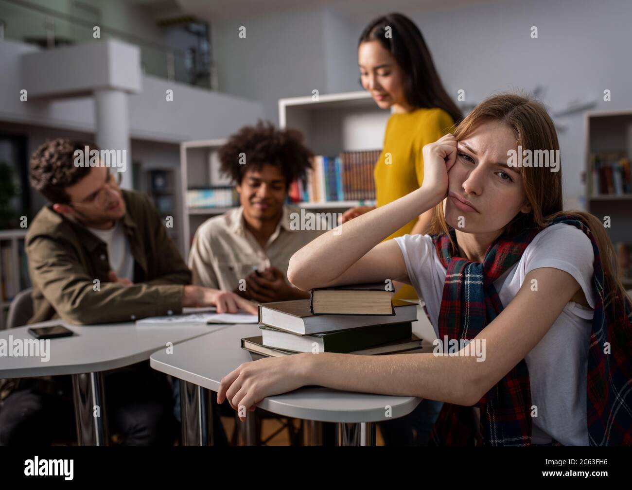 Tired university student has difficulty to study. Concept of stress ...