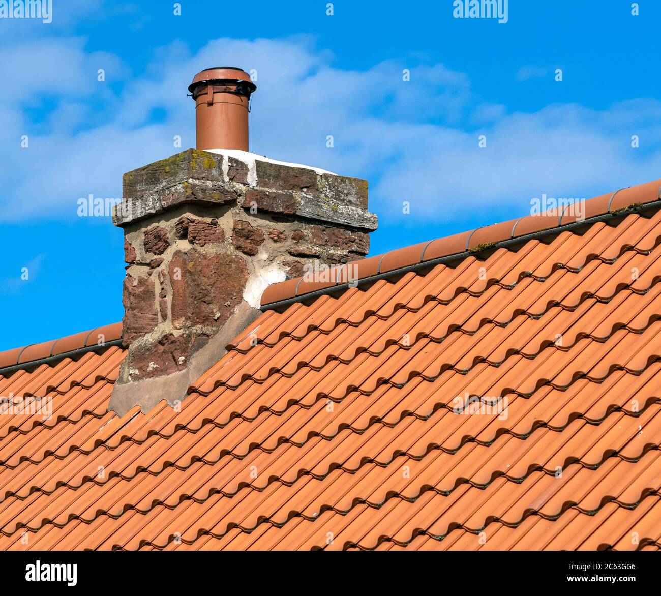 A red pantiled roof of a tradtional cottage in East Lothian, Scotland ...