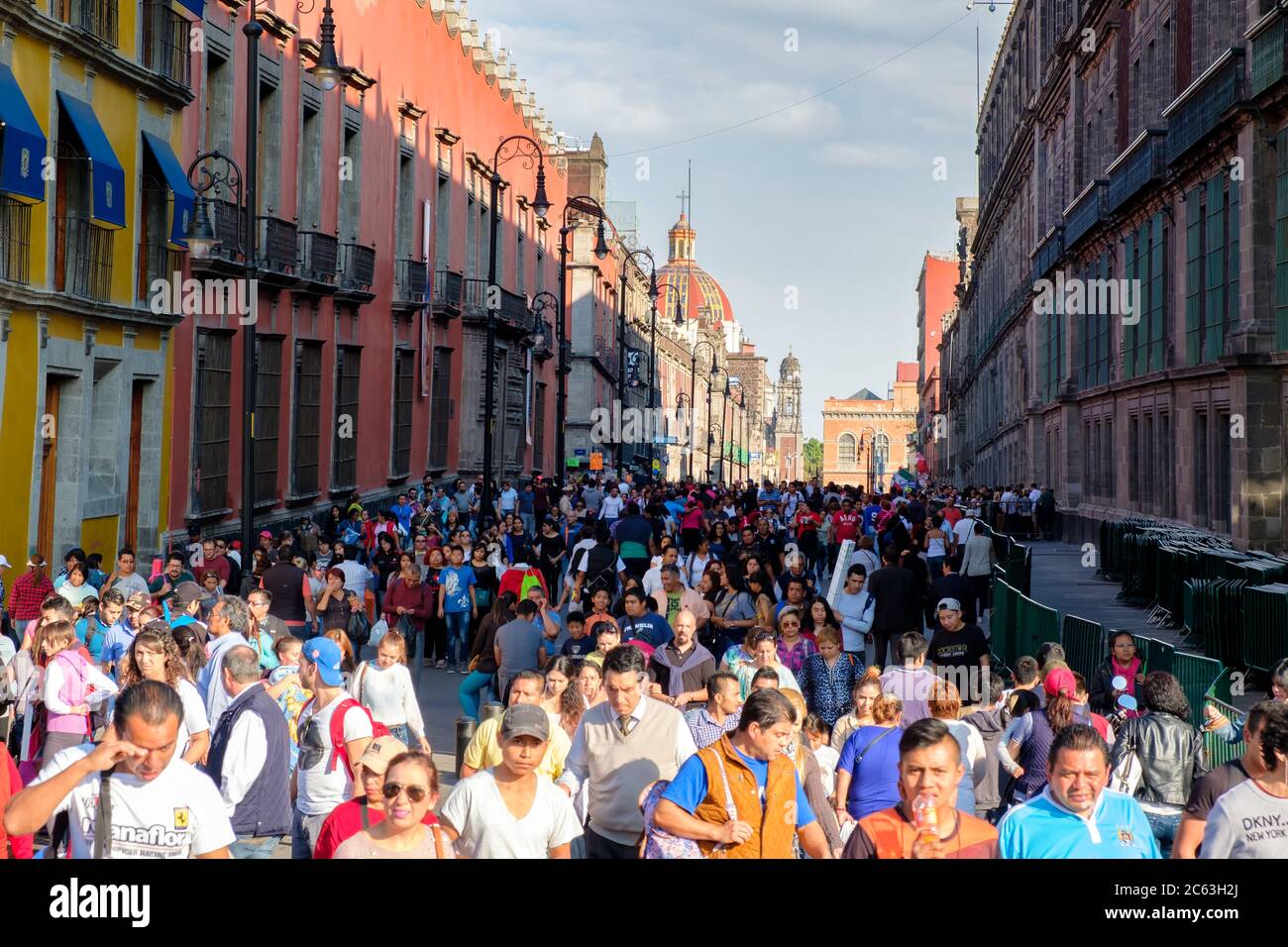 Huge crowd and colorful colonial buildings in central Mexico City Stock ...
