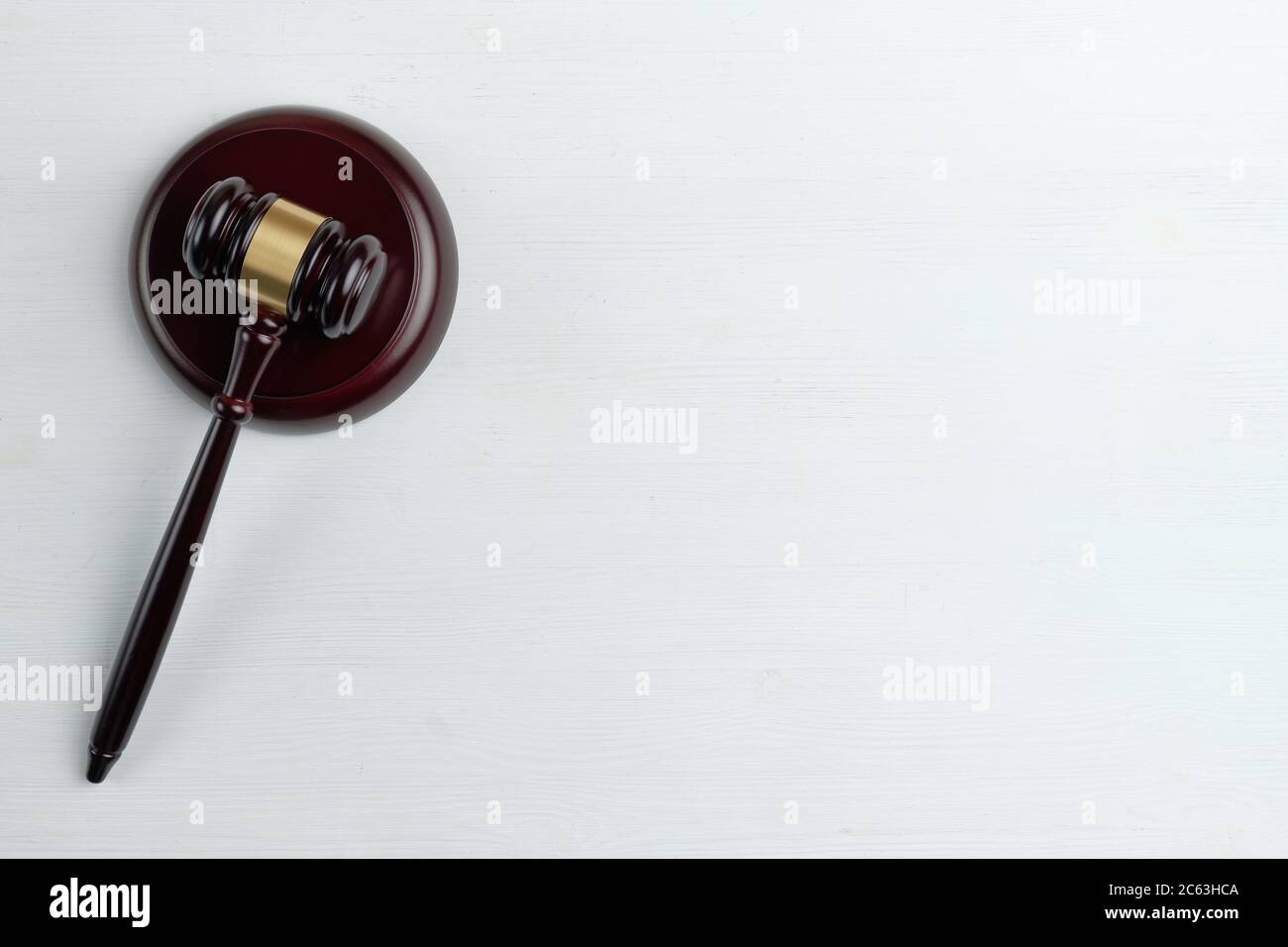 Judge hammer on a white wooden background with copy space and a top ...