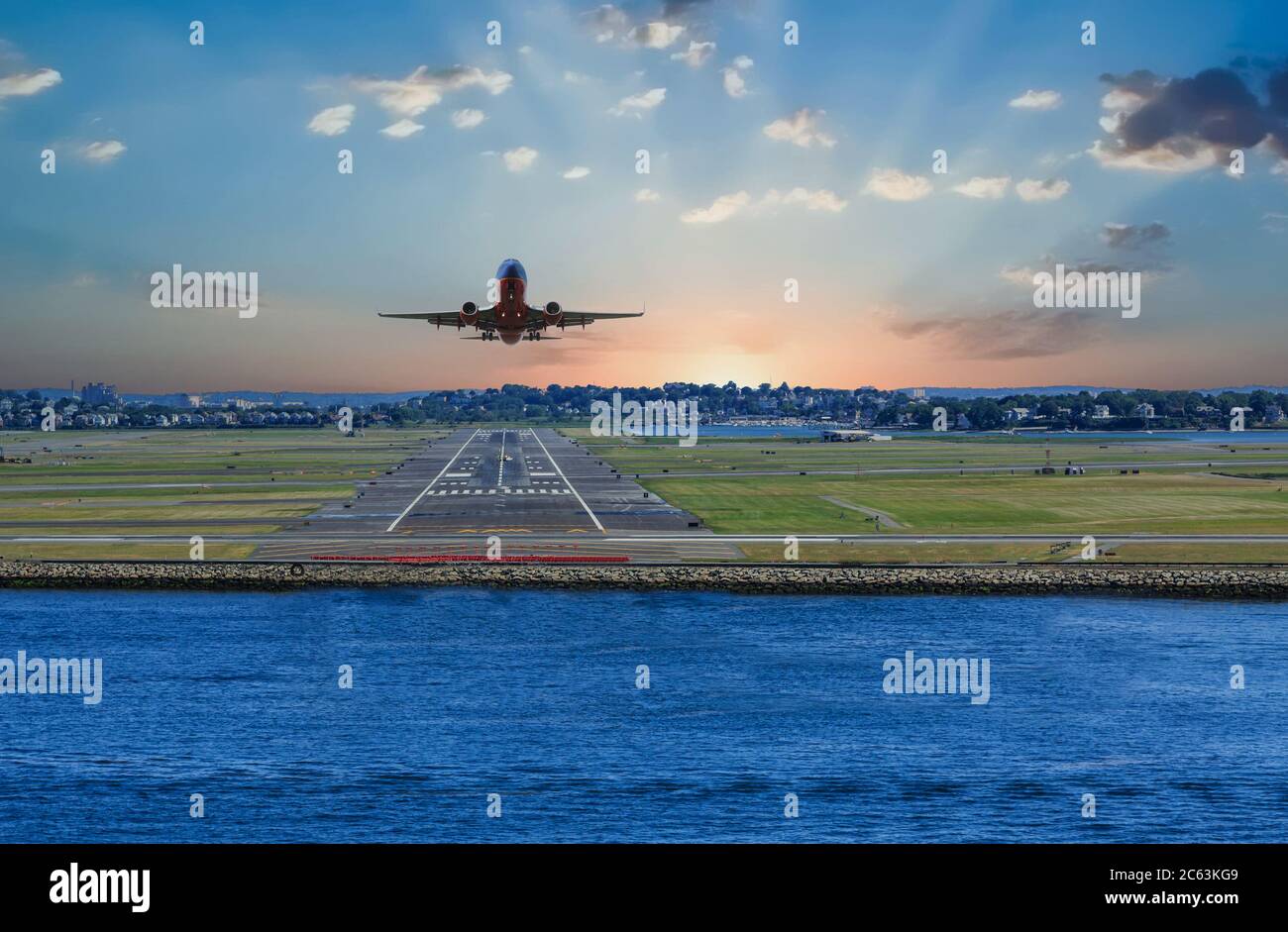 Plane Taking Off in Boston Sunrise Stock Photo - Alamy