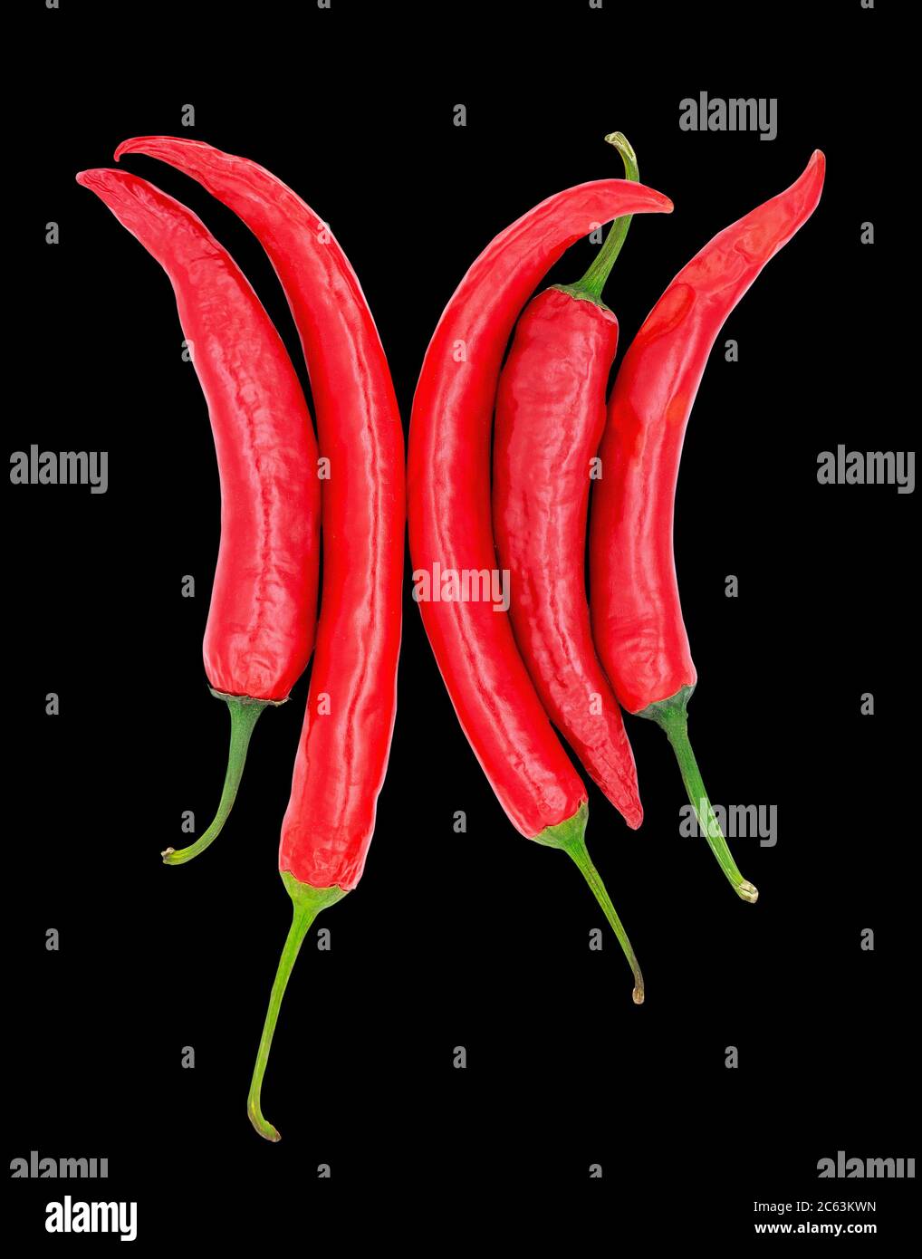 Red chilli, a few peppers isolated on a black background Stock Photo ...