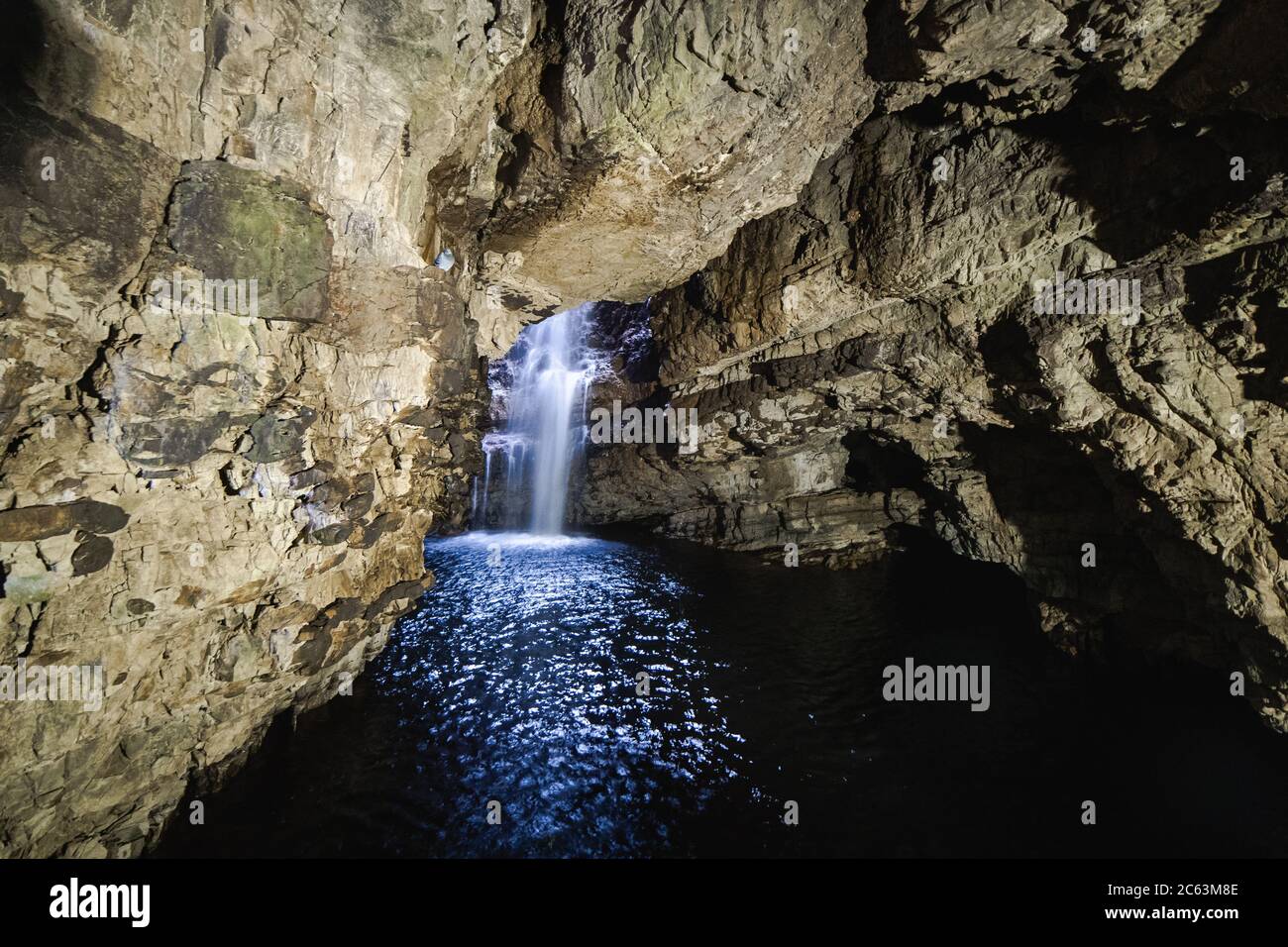 Cascading waterfall in underground cave Stock Photo - Alamy
