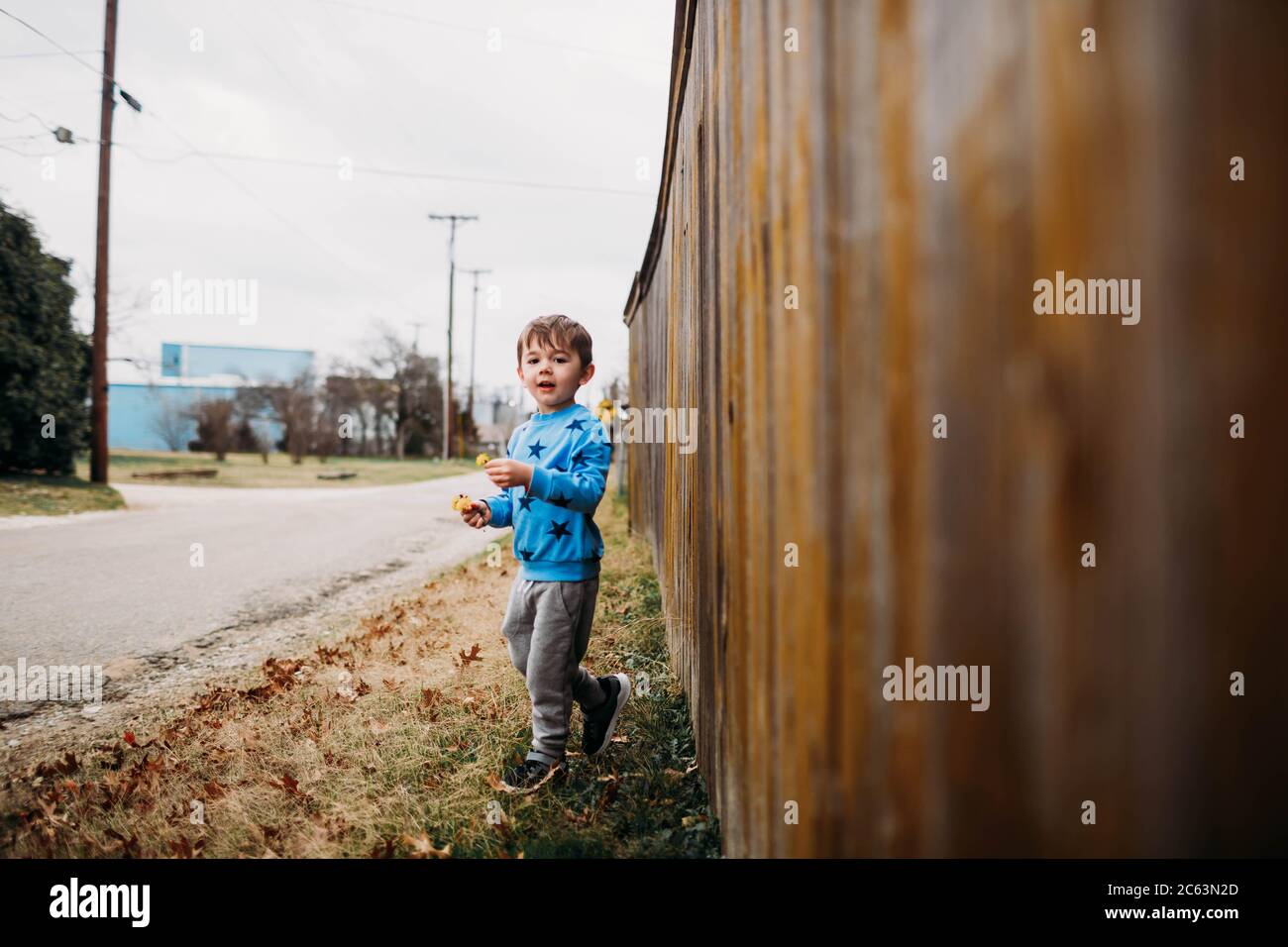 Young boy going on a walk on a cloudy day in spring Stock Photo - Alamy