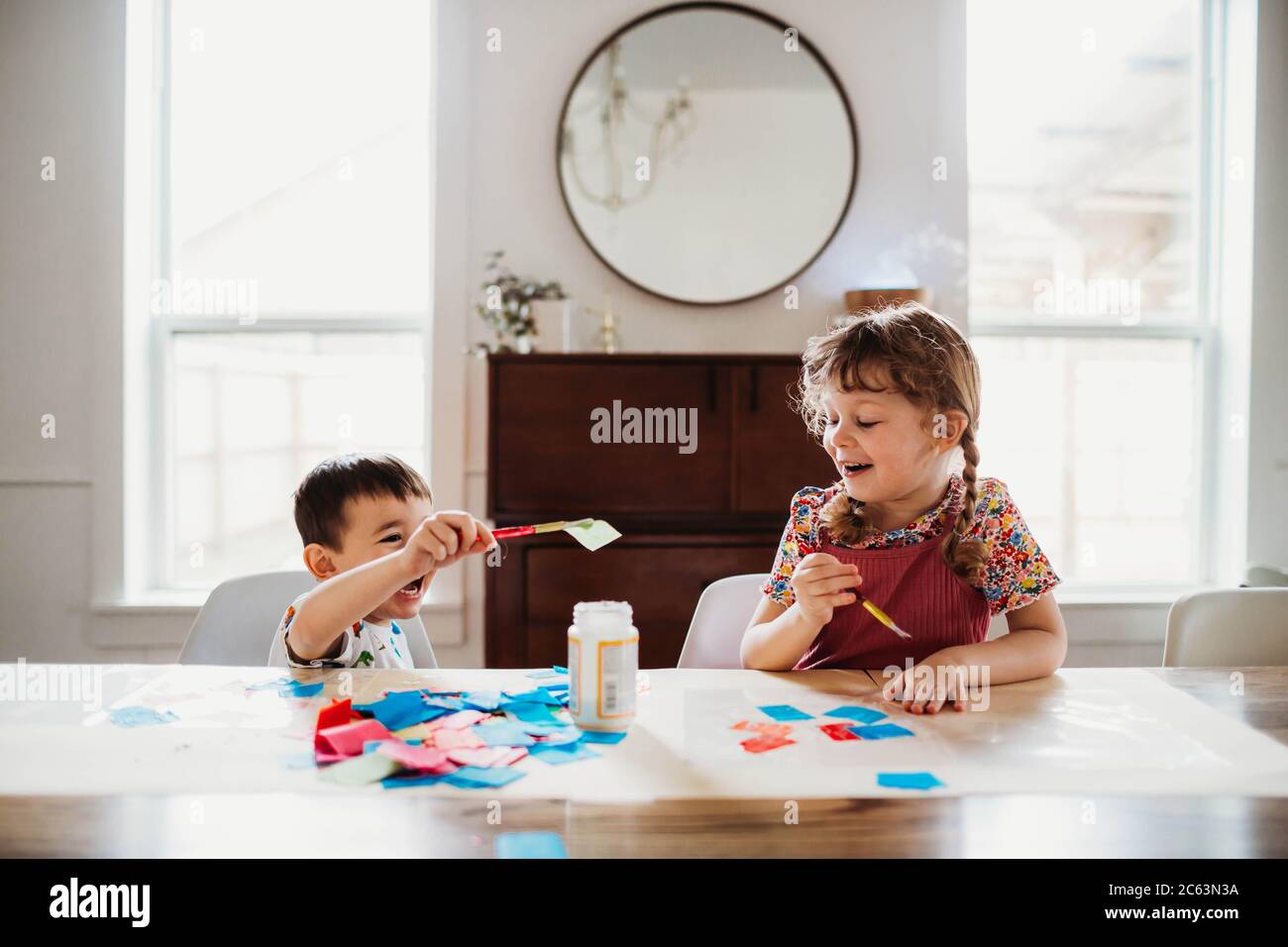 Brother and sister having art and crafts time together Stock Photo - Alamy