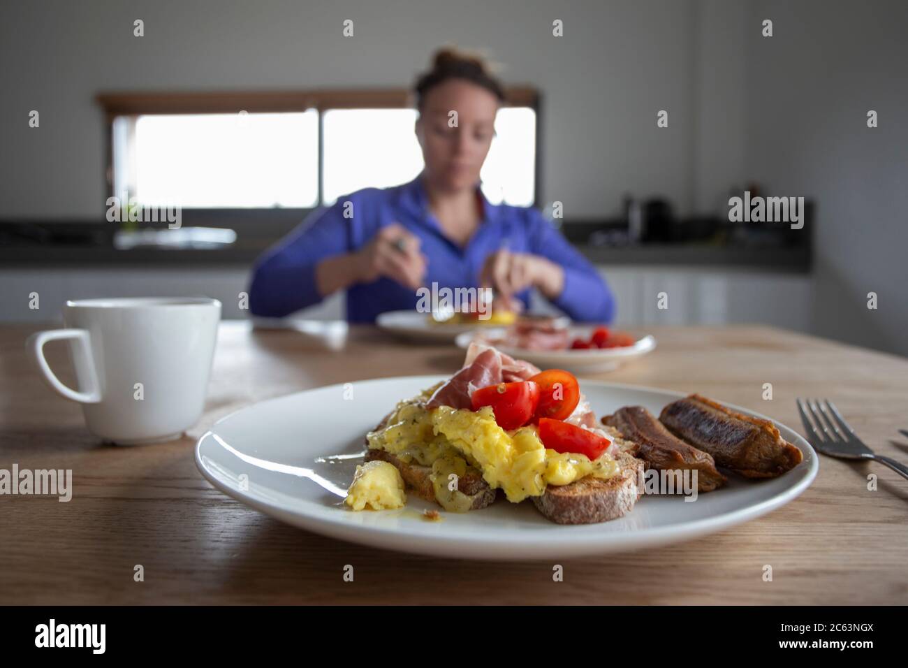 First person view of eating breakfast with someone Stock Photo - Alamy