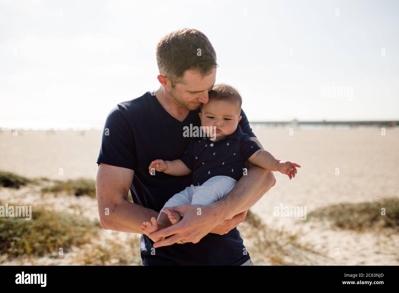 Cradling infant hi-res stock photography and images - Alamy
