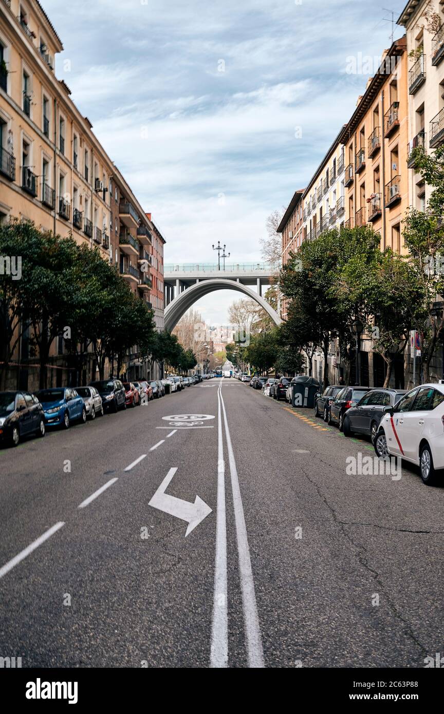 Low angle perspective view of old city street with residential ...