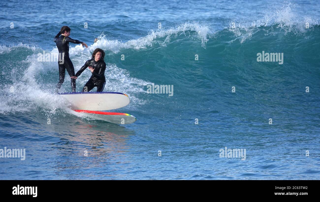 Surfers wave same hi-res stock photography and images - Alamy