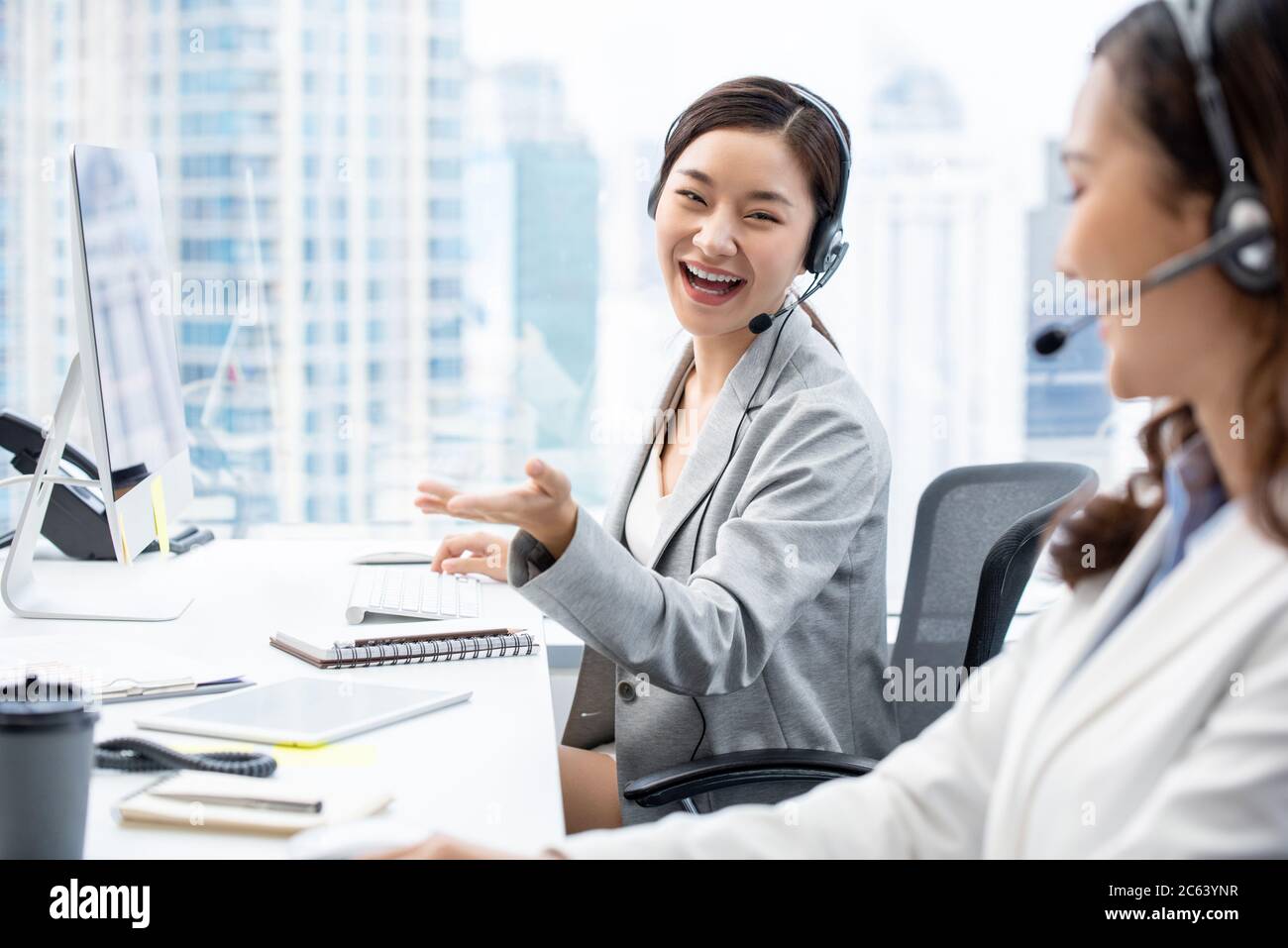 Asian female agent talking hi-res stock photography and images - Alamy