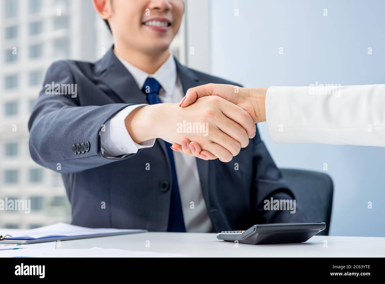 Happy handshake hi-res stock photography and images - Alamy
