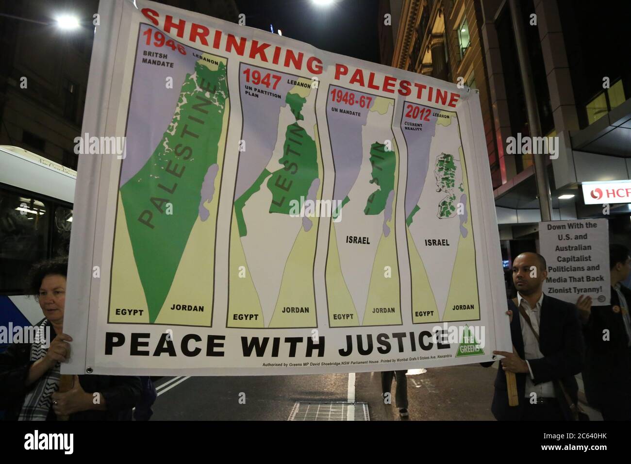 A banner showing the size of Palestine over the years is carried on the ...